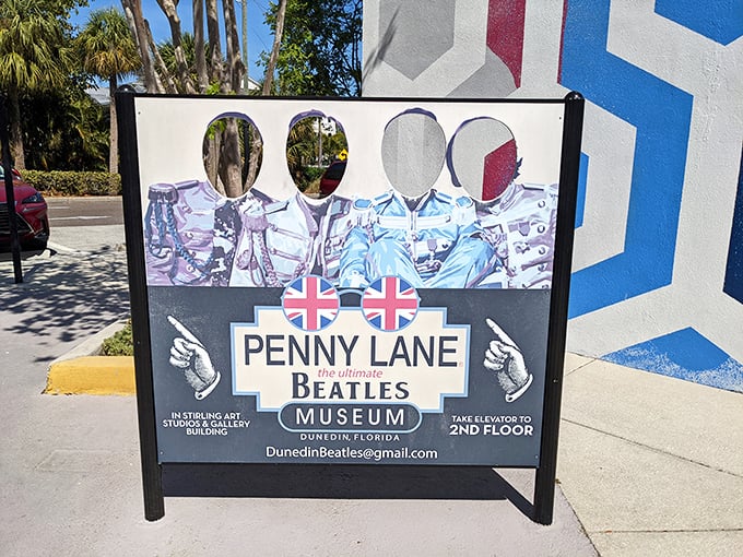 The museum's exterior sign invites passersby to stick their faces in the cutouts &ndash; instant Beatles transformation without the mop-top wig!