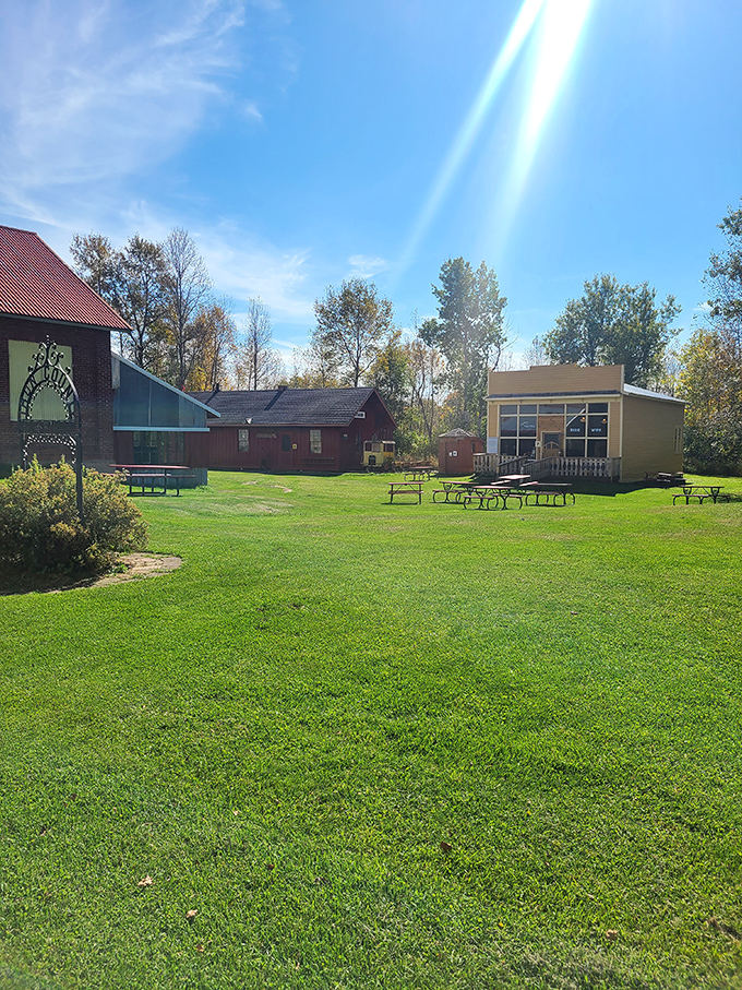Picnic Area: Sun-dappled grounds invite visitors to linger, picnic, and contemplate how much easier (and perhaps emptier) modern life has become.