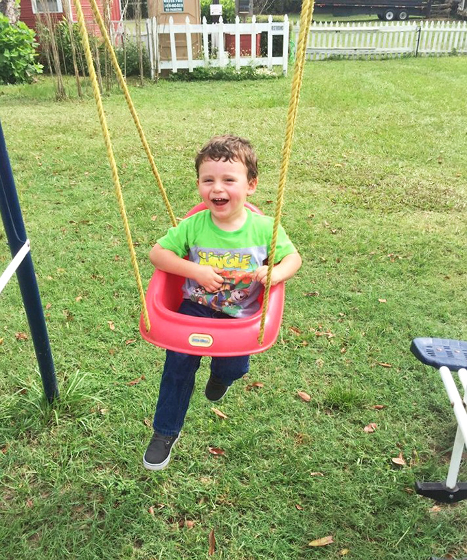 Pure childhood joy radiates from this playground swing, proving sometimes the simplest pleasures create the biggest smiles.