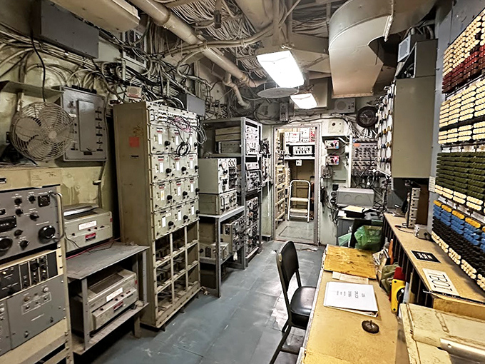 Radio Central served as the ship's ears and voice, where operators maintained crucial communication links with fleet command and other vessels.