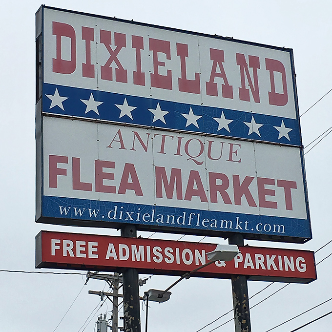 The red, white, and blue Dixieland sign stands as a beacon for bargain hunters, promising free admission to this indoor treasure hunt.