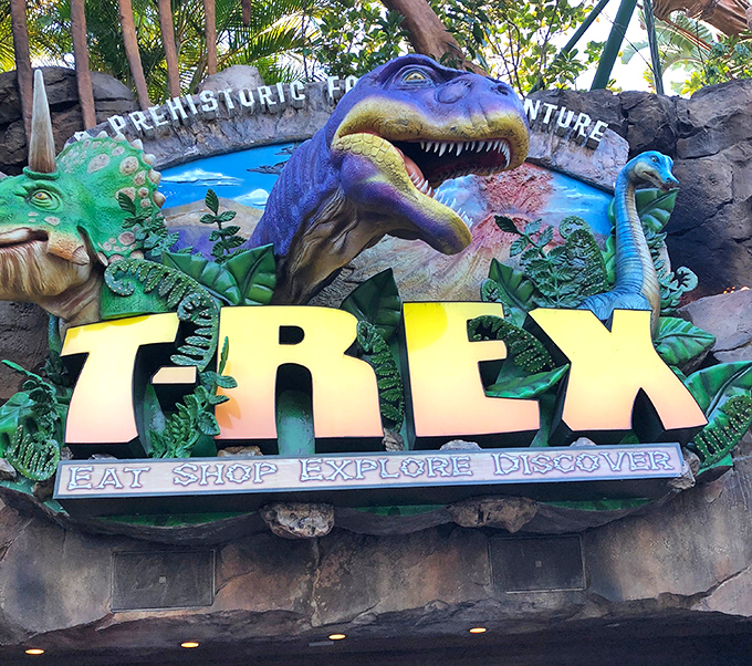 The vibrant T-REX signage promises four essential vacation activities: Eat, Shop, Explore, Discover &ndash; all under one prehistoric roof.