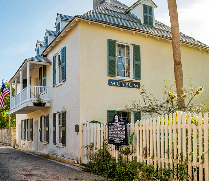 The Ximenez-Fatio House Museum's white picket fence says "historic landmark" in the most charming way possible.