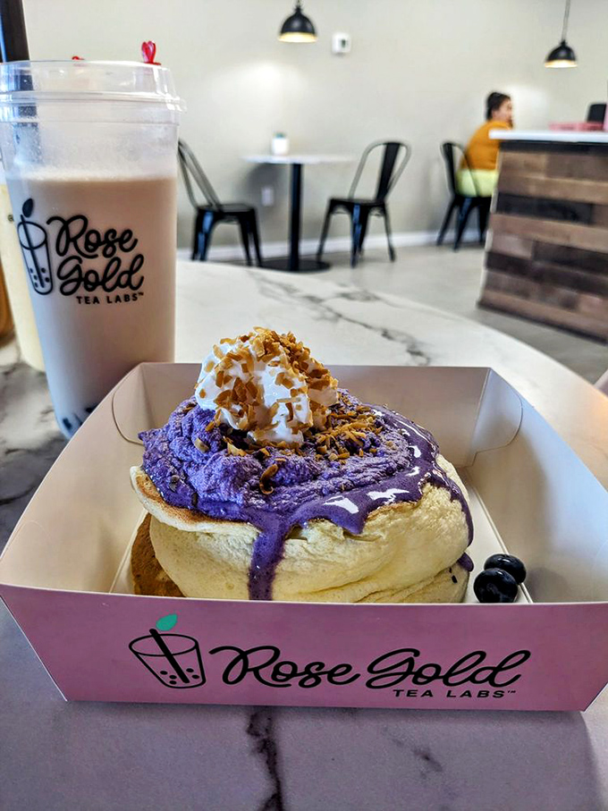 The Ube Kumo Fluffcake arrives in all its purple glory, topped with cream and berries &ndash; proof that sometimes the most delicious things come in unexpected colors.