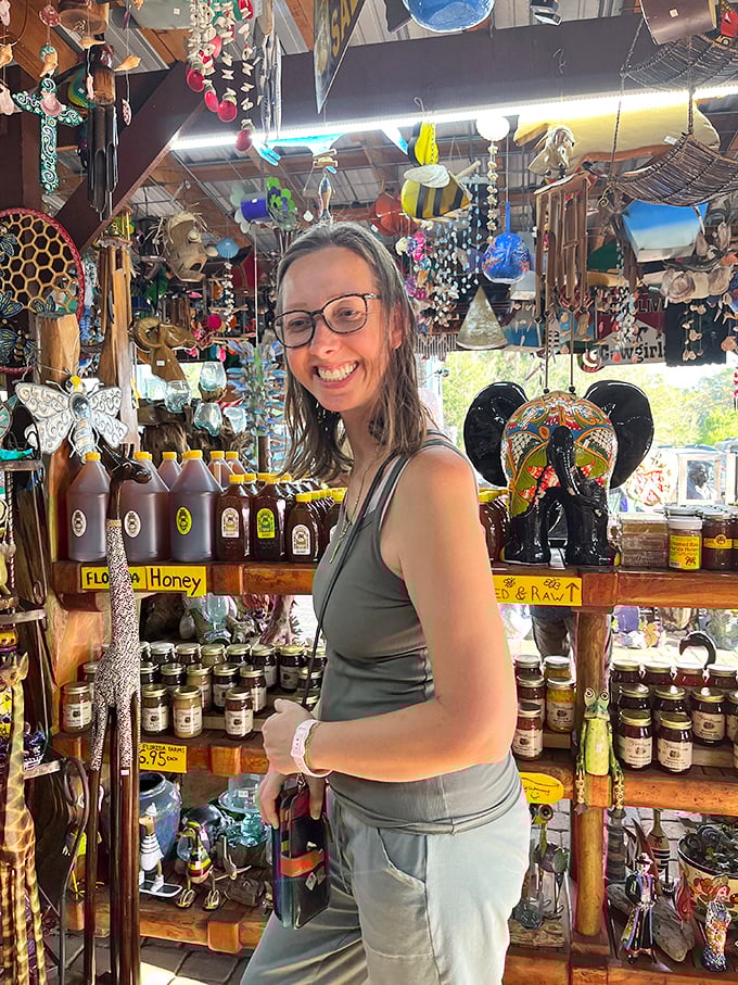 A visitor browses the impressive honey selection &ndash; sweet treasures amid the artistic offerings.