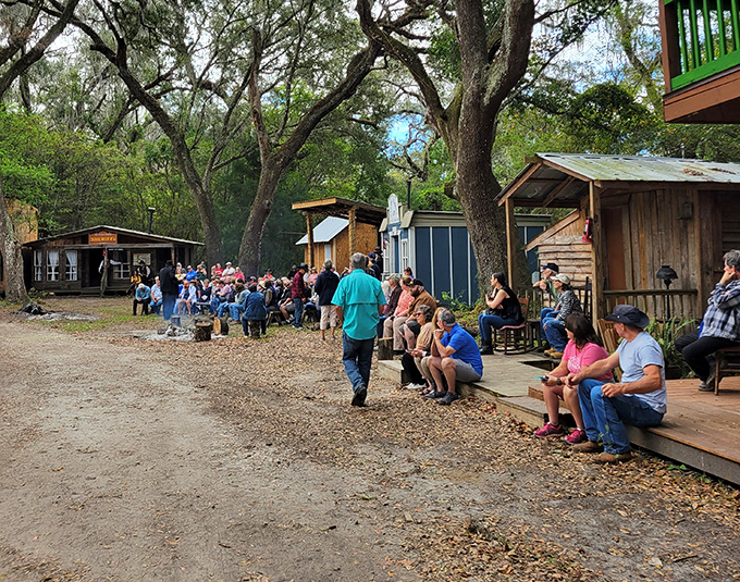 Visitors gather along the wooden boardwalk, their expressions showing that sometimes the simplest entertainments create the most lasting impressions.