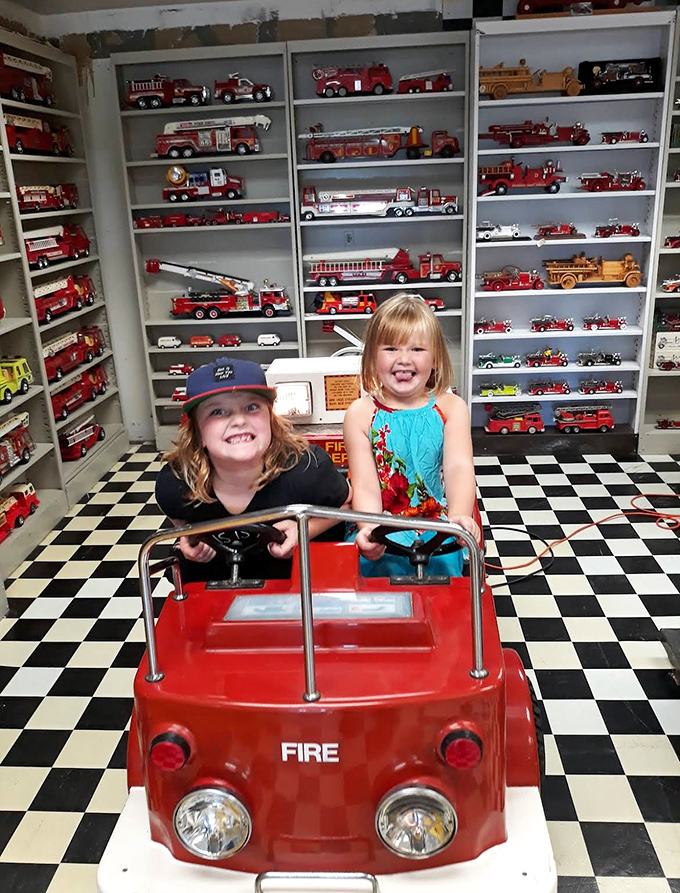 Young visitors discover the joy of imagination in the play area, where future firefighters can practice their rescue skills in miniature.