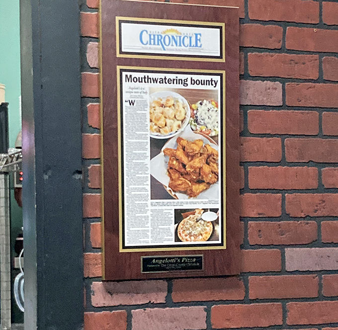 Local newspaper recognition proudly displayed, the humble brag of restaurants that have earned their place in the community's heart.