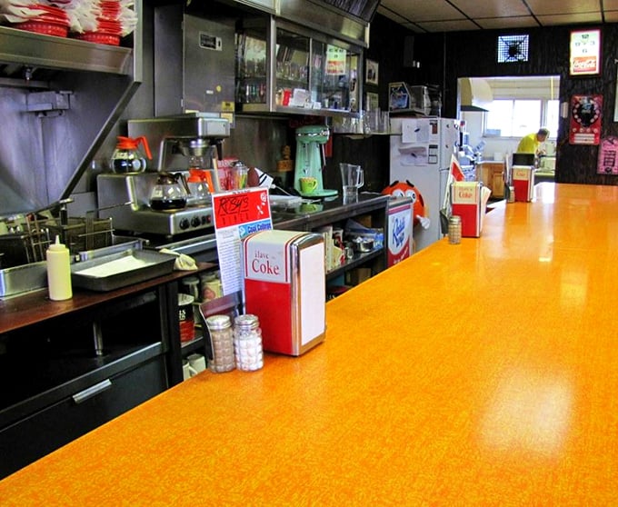 The counter isn't just for eating; it's where local news travels faster than the internet and coffee refills appear like magic.