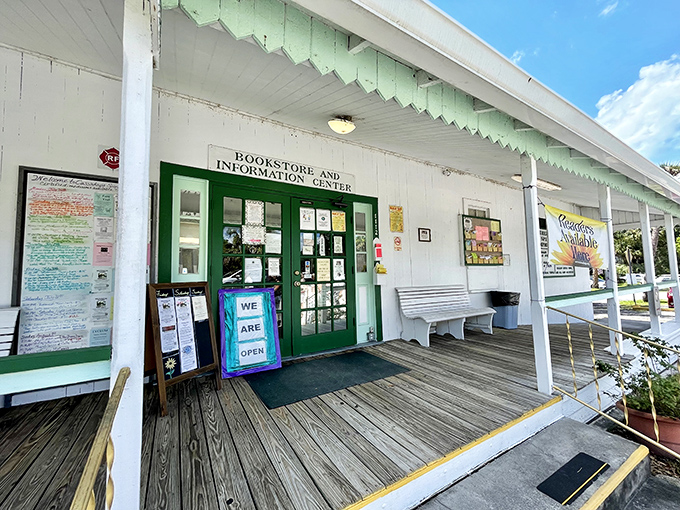The Bookstore and Information Center's inviting porch welcomes curious visitors with its "WE ARE OPEN" sign &ndash; as if they didn't already spiritually sense your arrival.