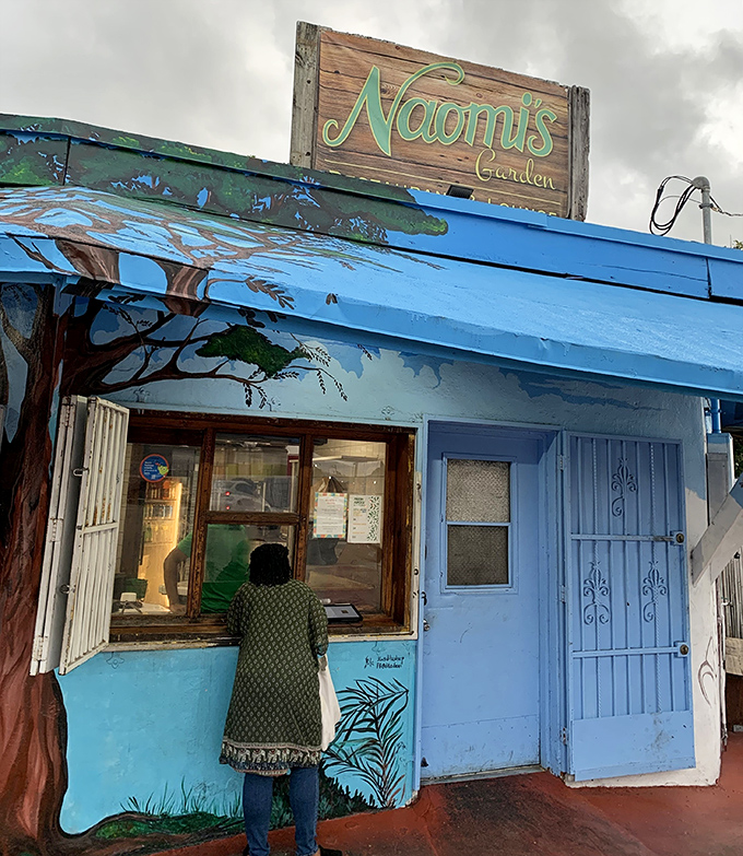The anticipation is palpable as another food pilgrim approaches the counter, about to join the ranks of Naomi's devoted followers.