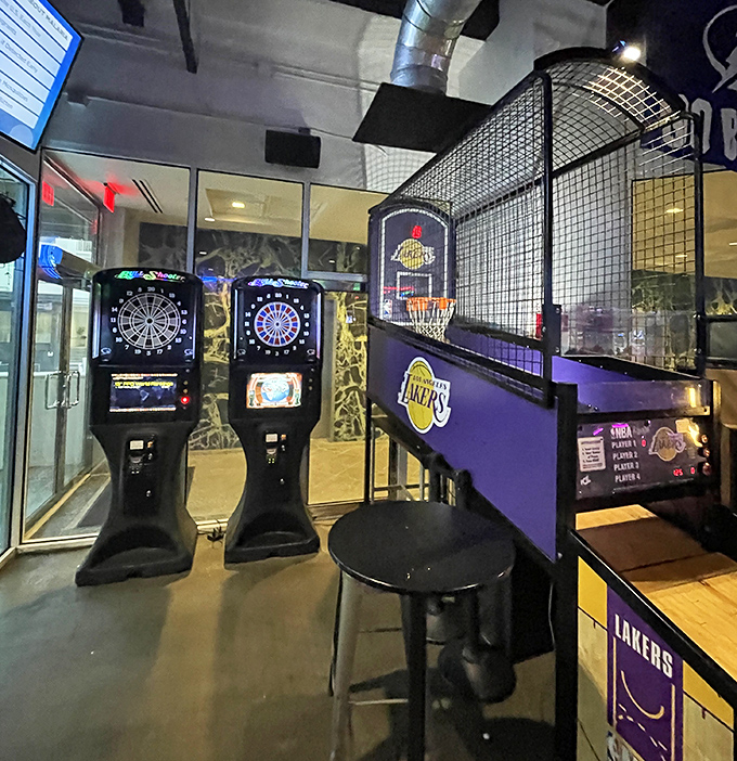 Electronic dart boards and basketball games ensure the competitive spirit of the '90s lives on between courses.