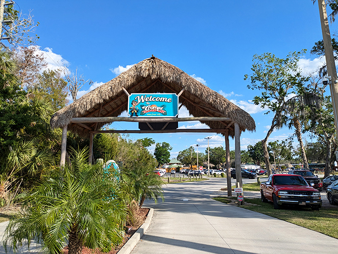 The thatched entrance arch stands like a portal between ordinary life and your next favorite Florida story. Adventure awaits just beyond.