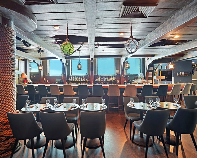 Modern comfort meets maritime history&mdash;sleek chairs and weathered beams create the perfect setting for tales of the sea (and exceptional seafood).