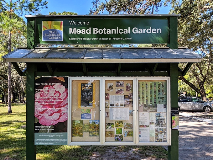 The garden's welcome sign stands as a portal between everyday life and this botanical sanctuary.