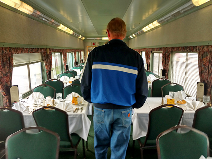 The dining car transforms into an intimate theater where every seat offers front-row access to the unfolding mystery between savory bites.