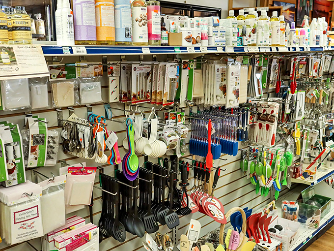 The kitchen tool wall displays gadgets both practical and puzzling, making you wonder how you've survived this long without a specialized avocado slicer.