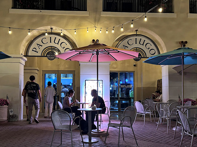 Twilight at Paciugo creates a magical atmosphere where conversations flow as freely as the gelato – notice the warm glow of string lights overhead.