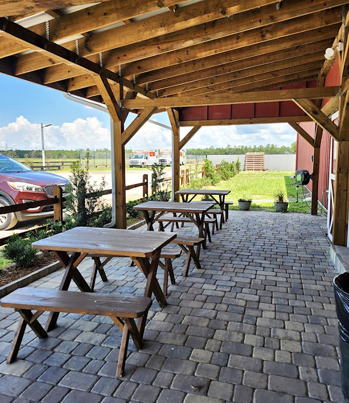 The covered porch offers respite from Florida heat &ndash; simple picnic tables provide the perfect spot for enjoying breakfast with a side of fresh air.