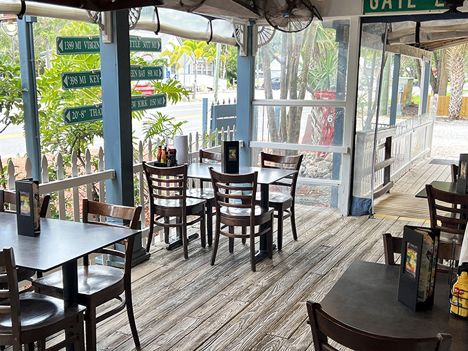 The outdoor setting offers a front-row seat to Key West's parade of characters, where golf carts replace taxis and palm trees provide nature's perfect shade.