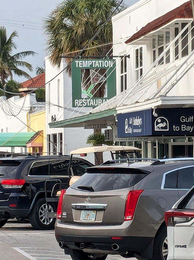 The restaurant's exterior view from the parking area shows its place among colorful neighboring businesses. A destination worth seeking out.