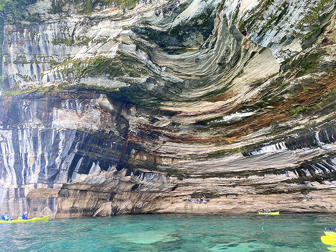 Nature's own abstract art gallery &ndash; swirling mineral patterns create a mesmerizing canvas of color against the ancient sandstone backdrop.
