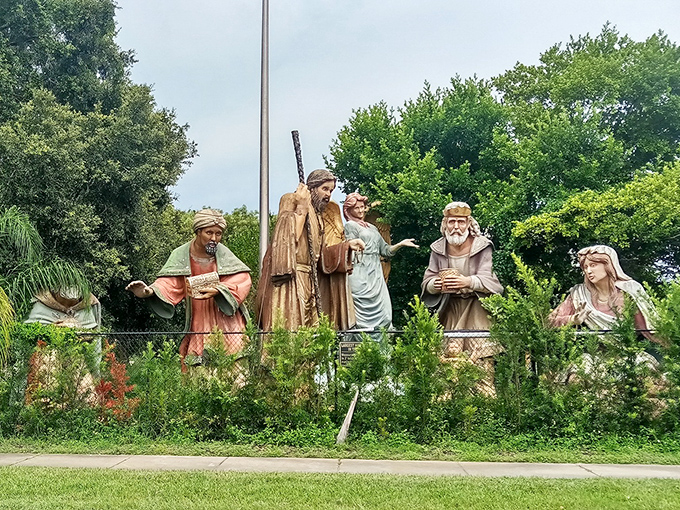 The nativity scene creates a striking silhouette against Florida's blue sky, palm trees adding a distinctly Sunshine State twist to this biblical tableau.