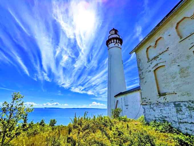 The lighthouse has been guiding ships safely for generations, standing watch over waters that can shift from calm to treacherous quickly.