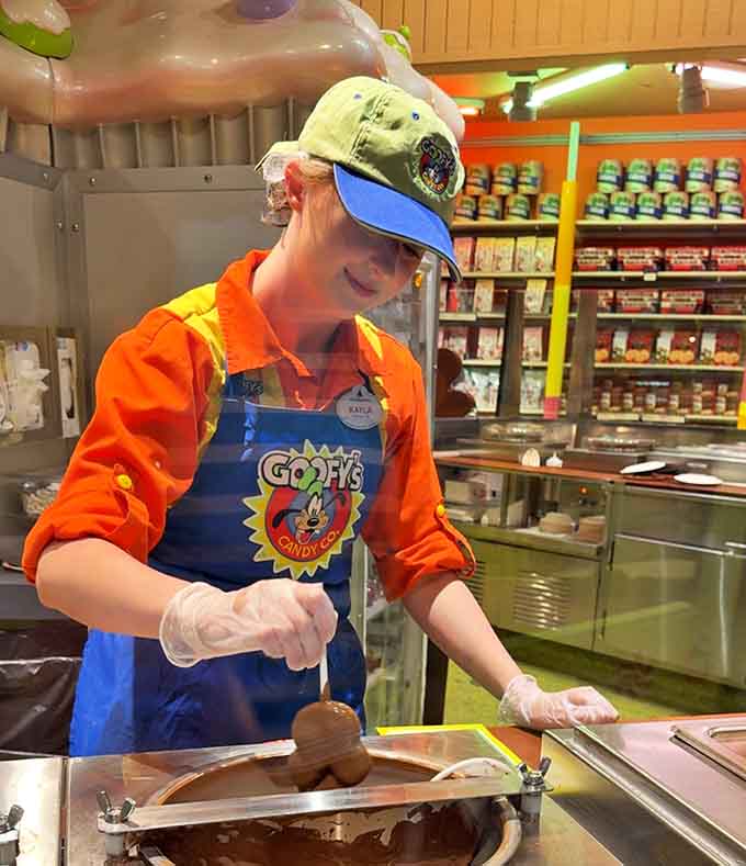 Behind every perfect chocolate-dipped treat is a cast member with steady hands and the patience of a confectionery artist.