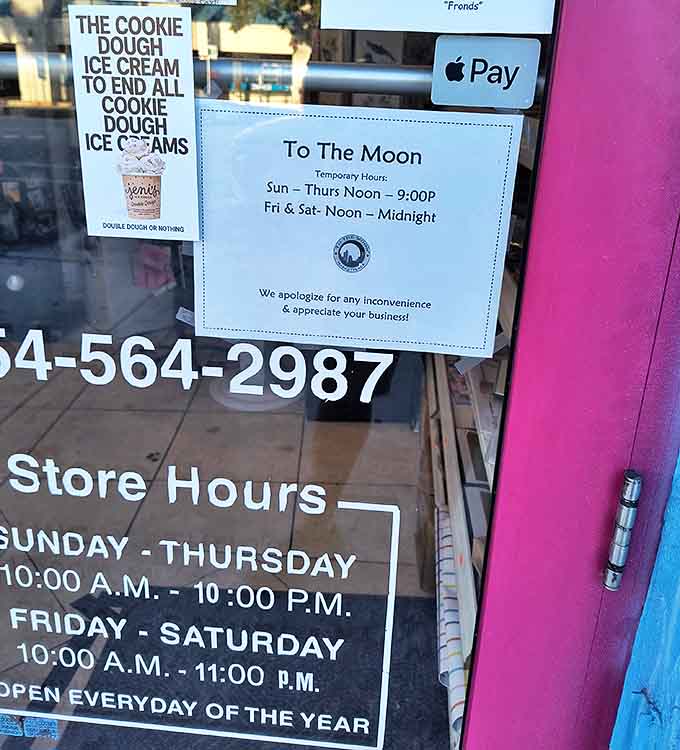 The store hours sign promises extended weekend hours &ndash; because candy emergencies respect neither bedtimes nor conventional retail schedules.