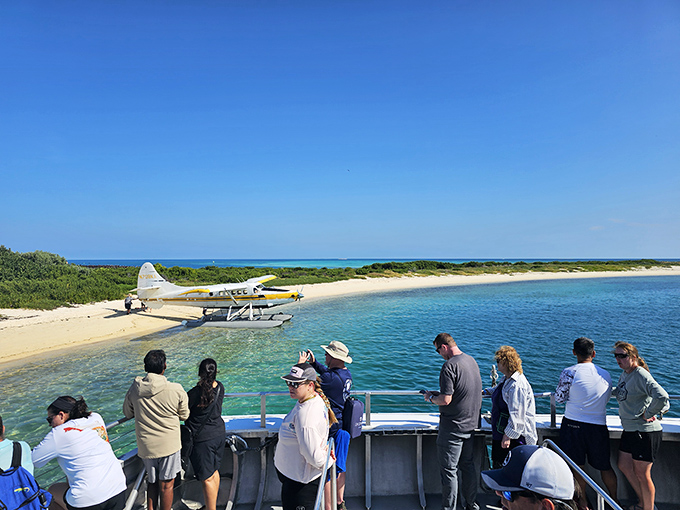 Visitors gather at the shoreline, momentarily united by the shared experience of discovering America's most beautiful secret.