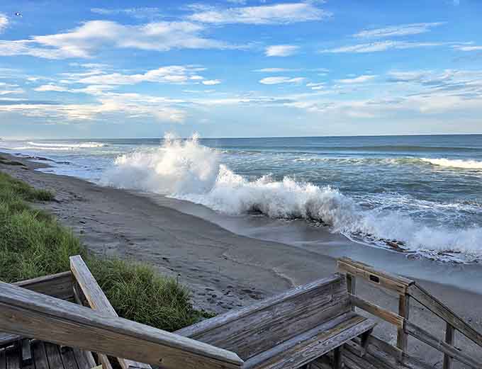Nature's percussion section in full swing! Waves crash against wooden steps, reminding visitors of the Atlantic's raw, untamed power.