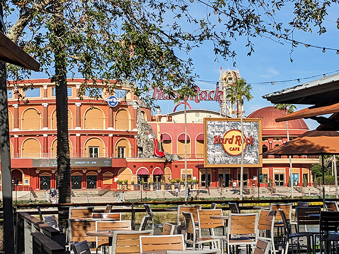 The Hard Rock Cafe&rsquo;s striking fa&ccedil;ade commands the view from this outdoor seating area, a true landmark within Universal Orlando.