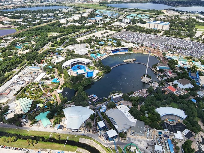 Complete Aerial View: SeaWorld's 200 acres blend thrill rides, animal habitats, and entertainment venues around a central lagoon, creating an oceanic playground where education meets excitement.