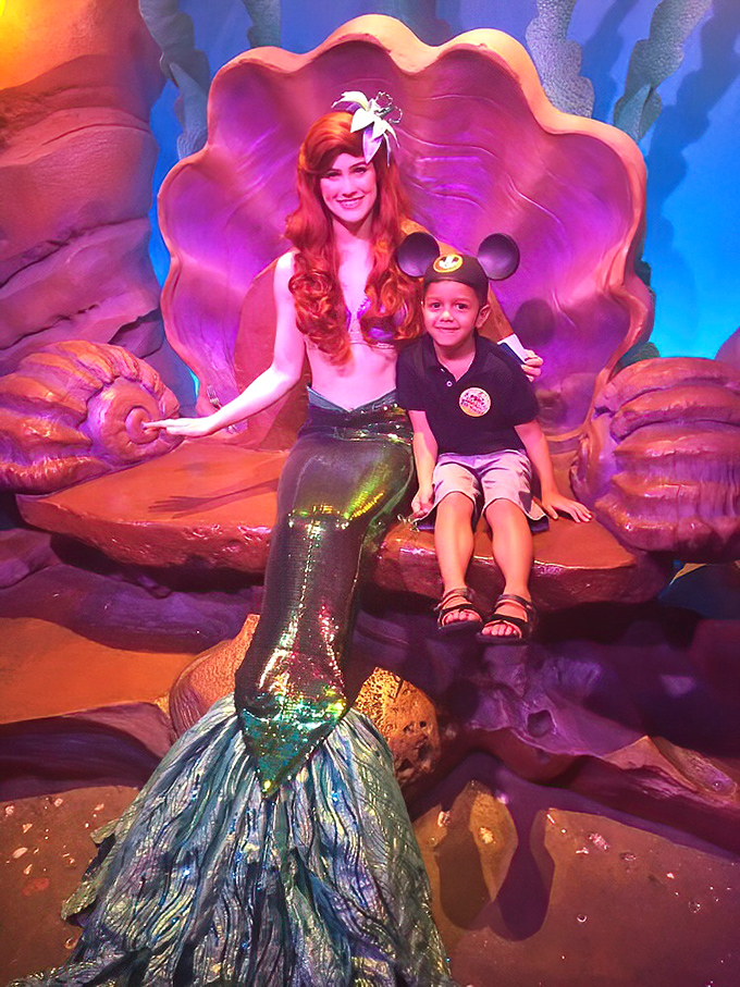 A magical moment between the mermaid princess and a young visitor. That smile is worth more than all the gadgets and gizmos combined.