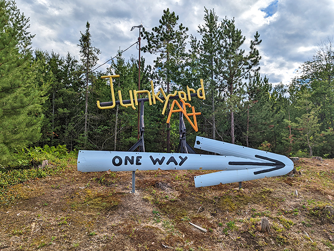 The "Junkyard Art" directional sign perfectly captures the park's unpretentious spirit, guiding visitors through this wonderland of repurposed metal masterpieces.