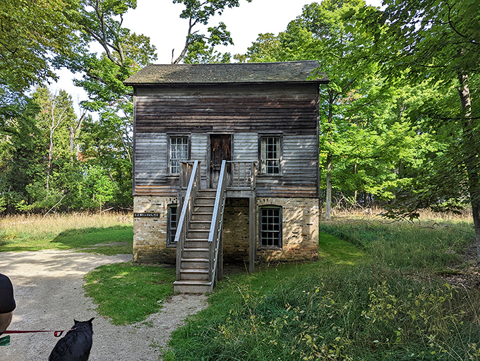 This modest structure housed workers who powered Michigan's industrial revolution, their stories etched in weathered wood and stone.
