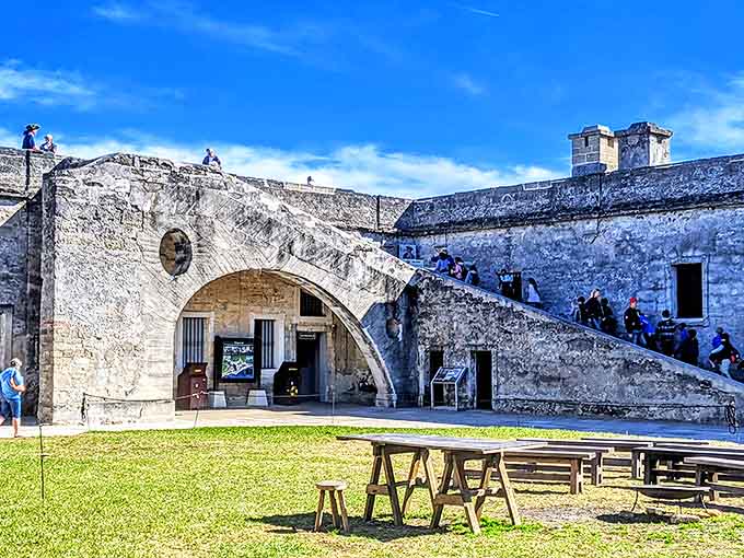 The fort's interior courtyard where soldiers once gathered now welcomes visitors seeking shade and stories from centuries past.