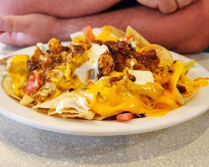 Nachos that don't understand the concept of personal space&mdash;every chip fighting for its share of cheese, meat, and toppings. This isn't a snack; it's a commitment.