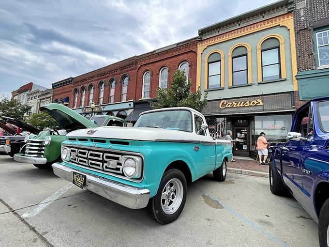 Classic Car Display: Perfect companions &ndash; vintage vehicles parked outside a vintage candy store, both representing American craftsmanship at its finest.