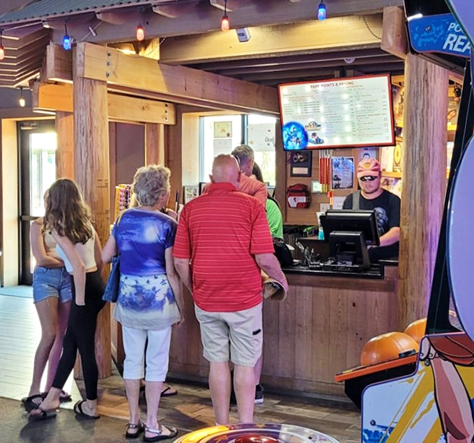 Families line up for refreshments at this rustic counter, where theme park food exceeds expectations and refuels adventurers for more fun.