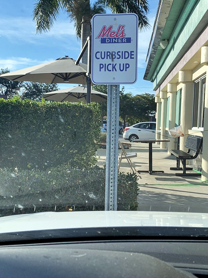 The "Curbside Pickup" sign &ndash; modern convenience meets retro dining, proving that even classics can adapt without losing their soul.