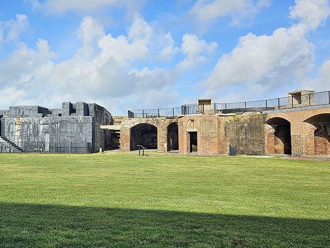 Exterior wall and moat area: Where weathered brick meets manicured grass, history and groundskeeping join forces in perfect harmony.