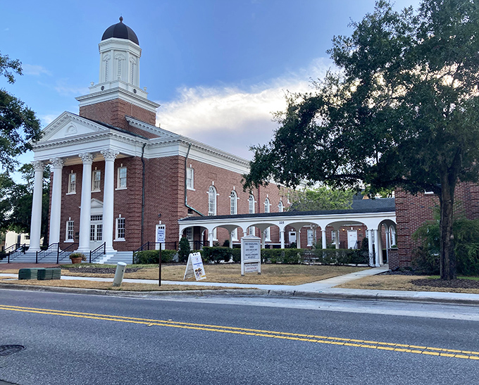 First Congregational Church stands as Winter Park's architectural anchor &ndash; its classic red brick and white steeple practically demanding to be photographed against Florida's azure sky.