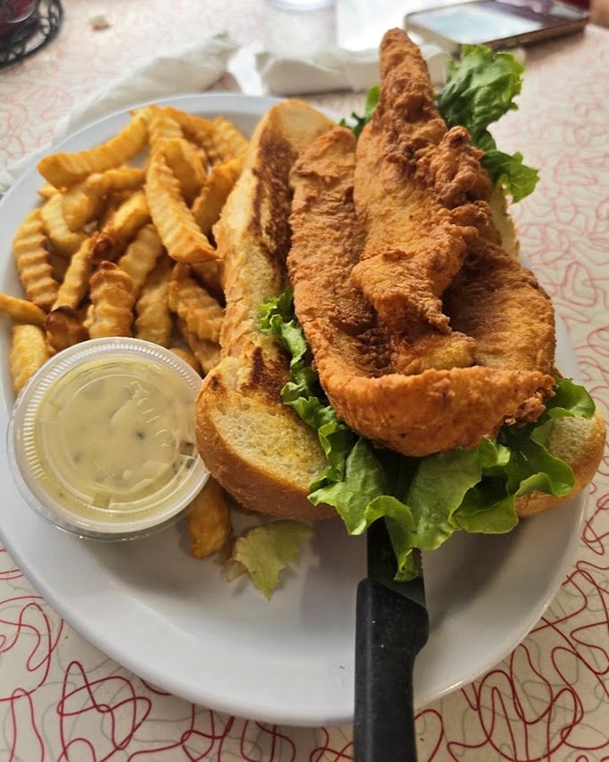 This fish sandwich isn't messing around &ndash; golden-fried perfection on a soft bun with crisp lettuce and a side of those addictive crinkle fries.