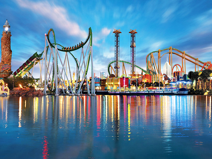 As night falls, Islands of Adventure transforms into a symphony of lights and reflections, where every ride becomes twice as magical after sunset.