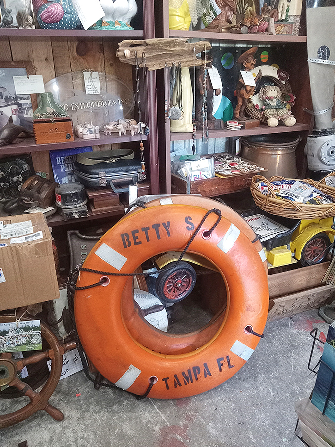 The "Betty" life preserver from Tampa stands as a silent sentinel of maritime history amid the creative chaos of Hong Kong Willie's.