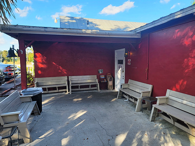 A humble waiting area that becomes an impromptu social club on busy mornings, where strangers become friends while anticipating pancake perfection.
