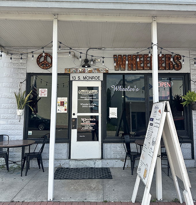 Wheeler's exterior with its illuminated sign promises authentic small-town dining experiences that chain restaurants can only dream of replicating.