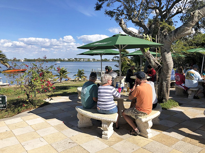Outdoor seating offers waterfront views and fresh air, perfect for enjoying a cold drink after exploring the island's nature trails.